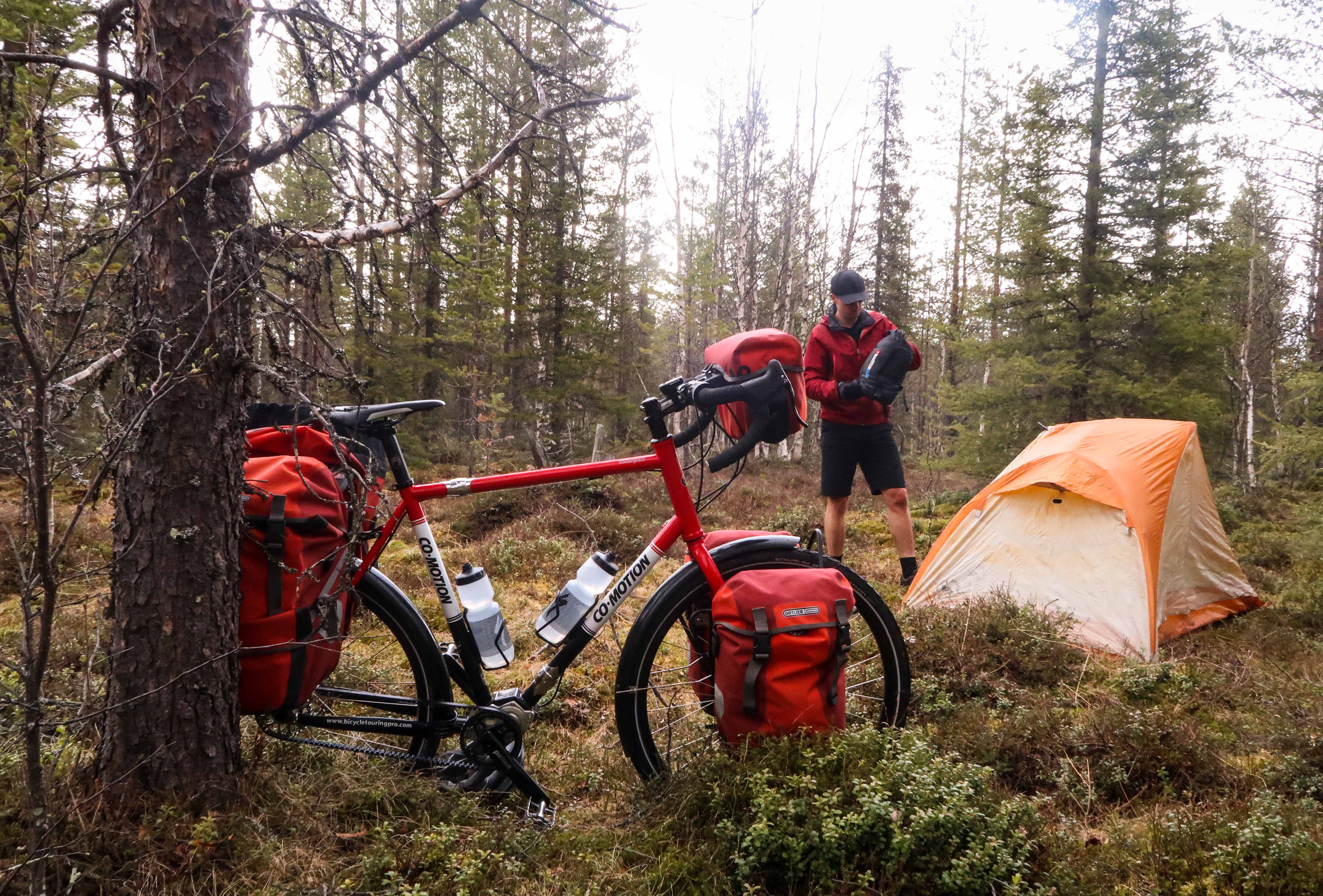 Bikepacker setting up camp at the end of long cycling day – Bicycle ...